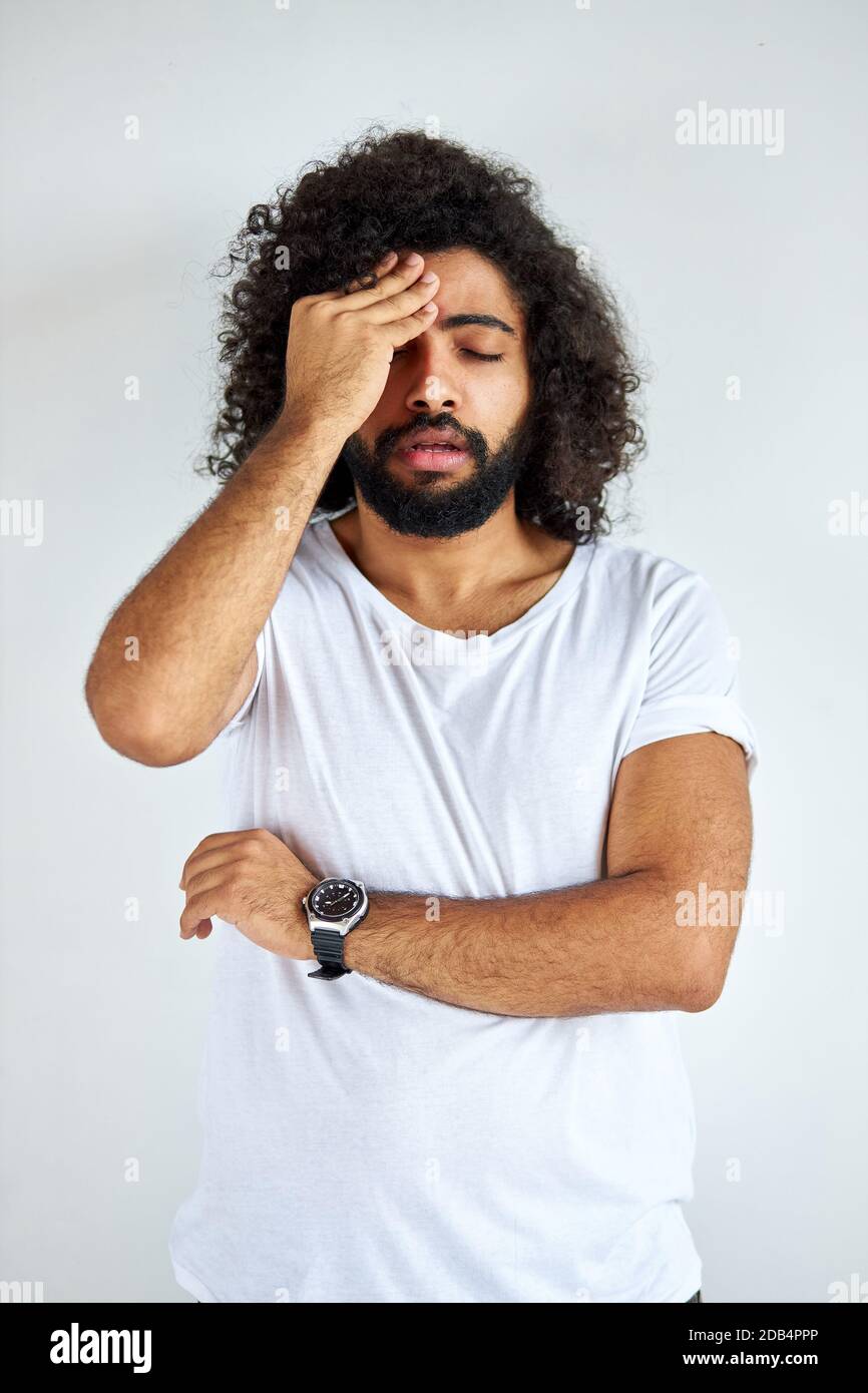 portrait of thoughtful young arabic arabian male isolated in studio ...