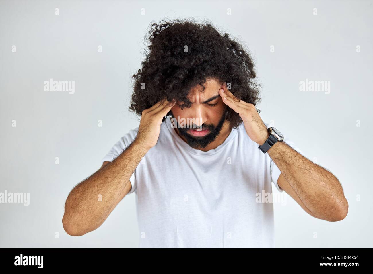 sad arabic man has problems, he is depressed, hold hand on head, stand ...