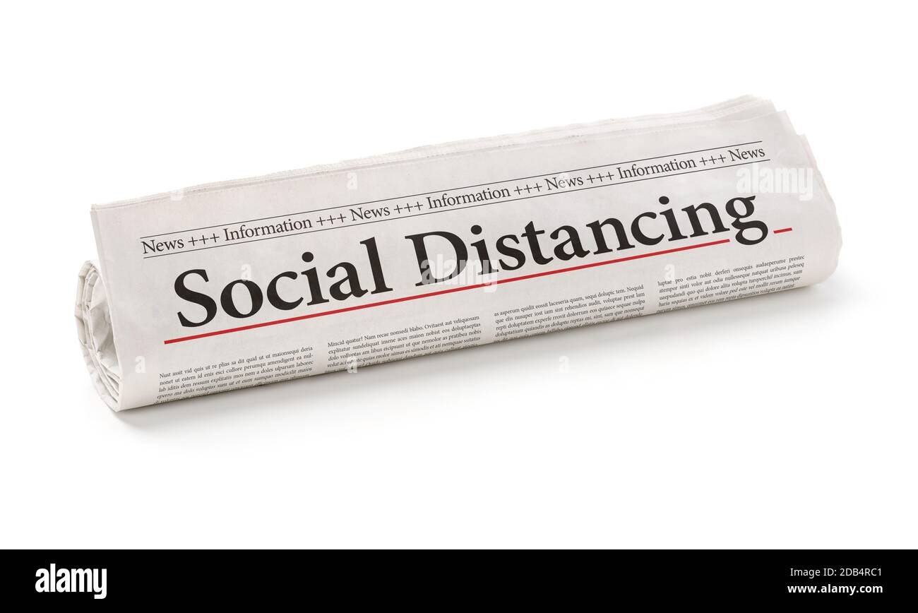 Rolled newspaper with the headline Social Distancing Stock Photo - Alamy
