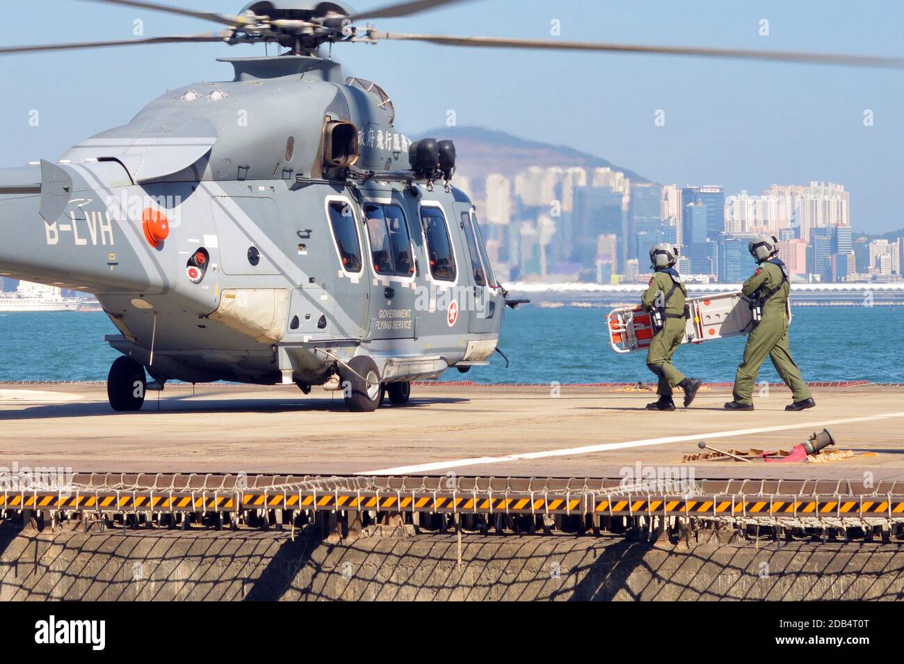 Government Flying Service (政府飛行服務隊) aircrewmen return a stretcher to an ...