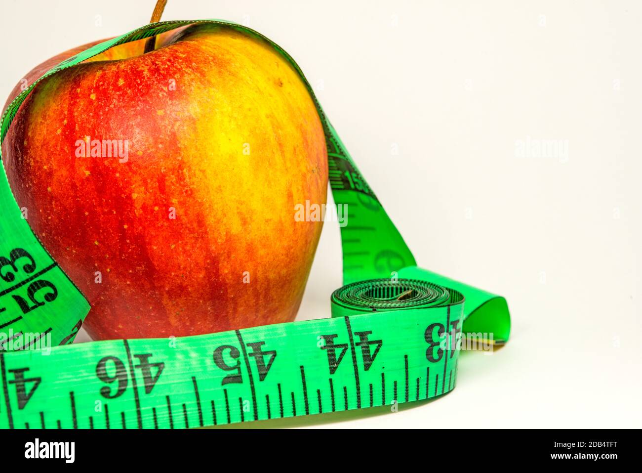 apple with a tape measure Stock Photo - Alamy