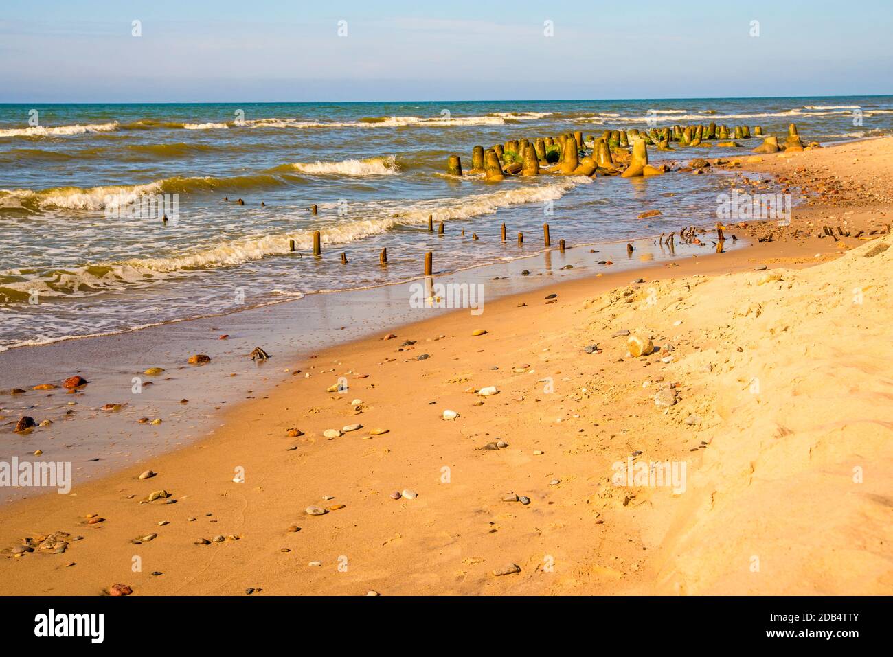 beach of the Baltic Sea in Poland with wave-breaker Stock Photo - Alamy