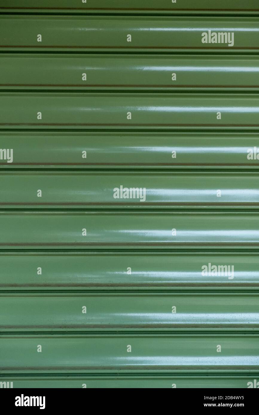 Metal roller shutter texture background, green color. Store entrance ...