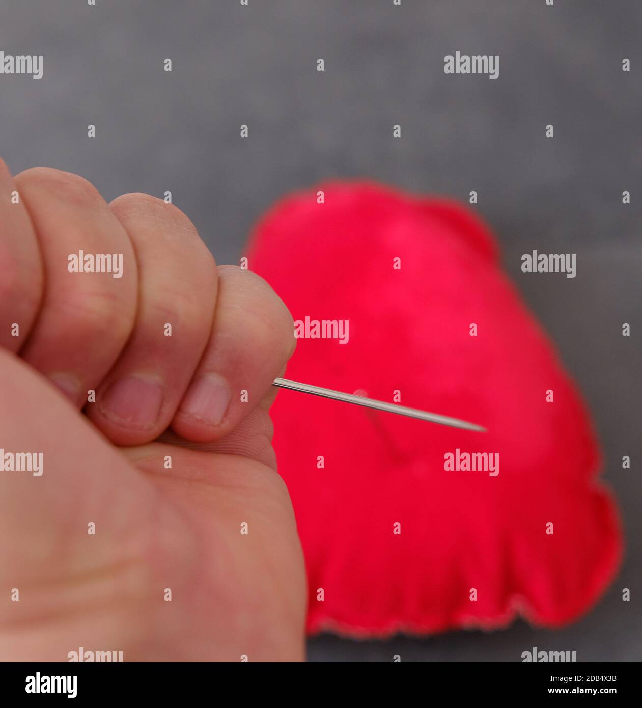 needle and heart shaped pincushion, needle and pincushion Stock Photo ...