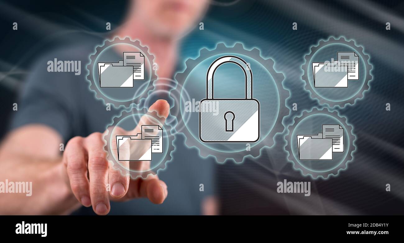 Man touching a data protection concept on a touch screen with his ...