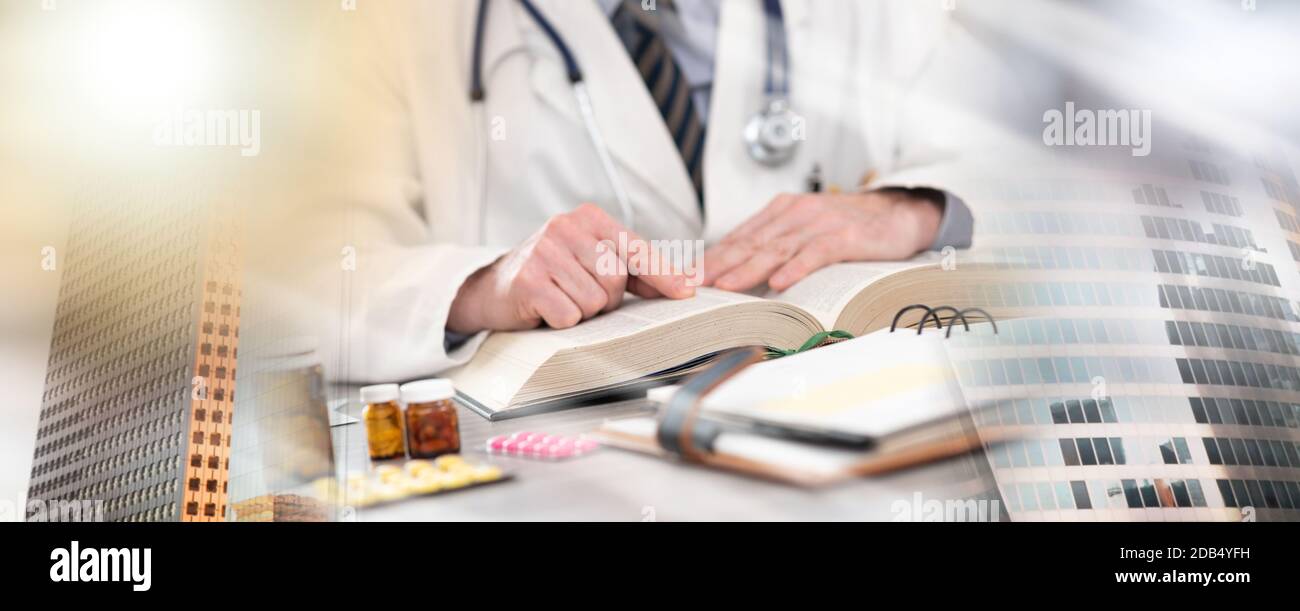 Doctor reading a textbook in medical office; multiple exposure Stock ...