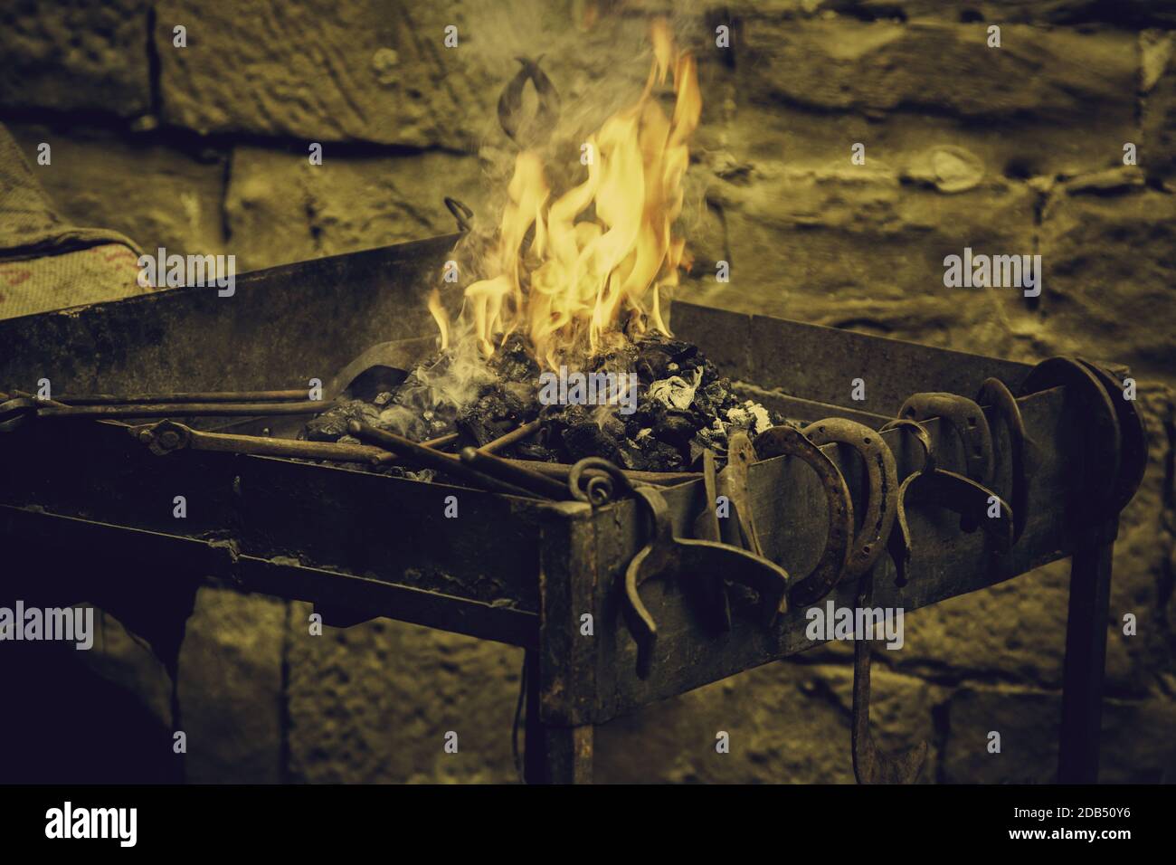 Carbon fire in a forge, detail of a workshop with iron Stock Photo - Alamy
