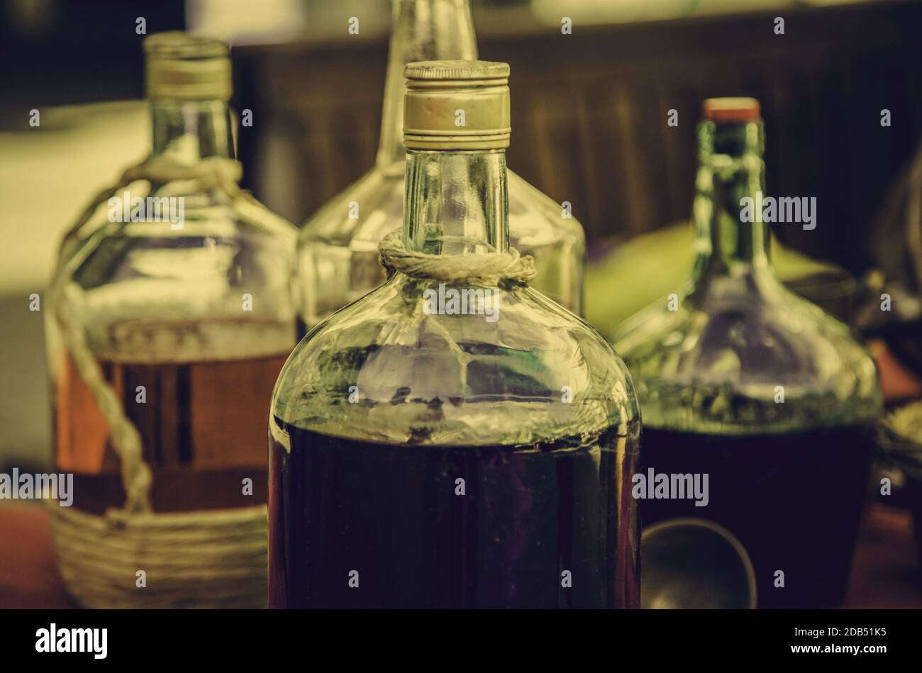 Bottles with colored liquid, detail of colors and glass, containers ...