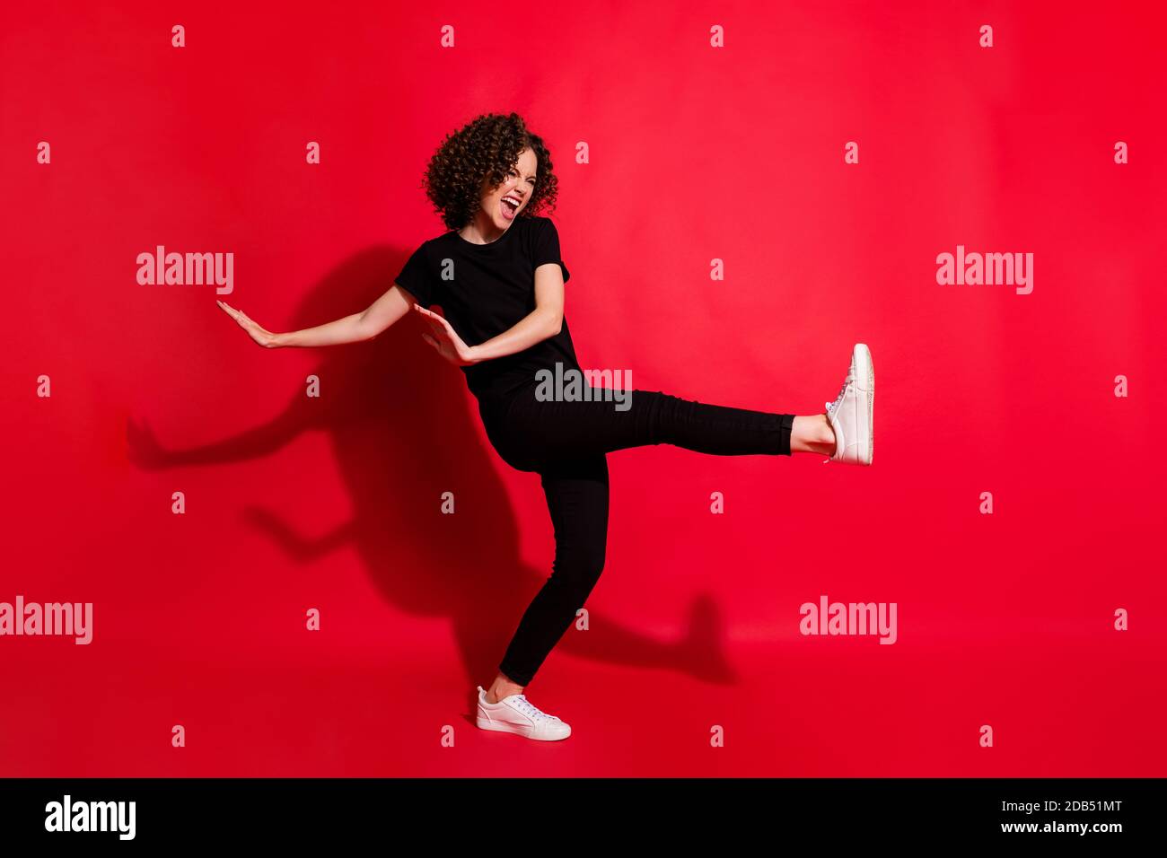 Photo portrait full body view of girl kicking raising leg dancing ...