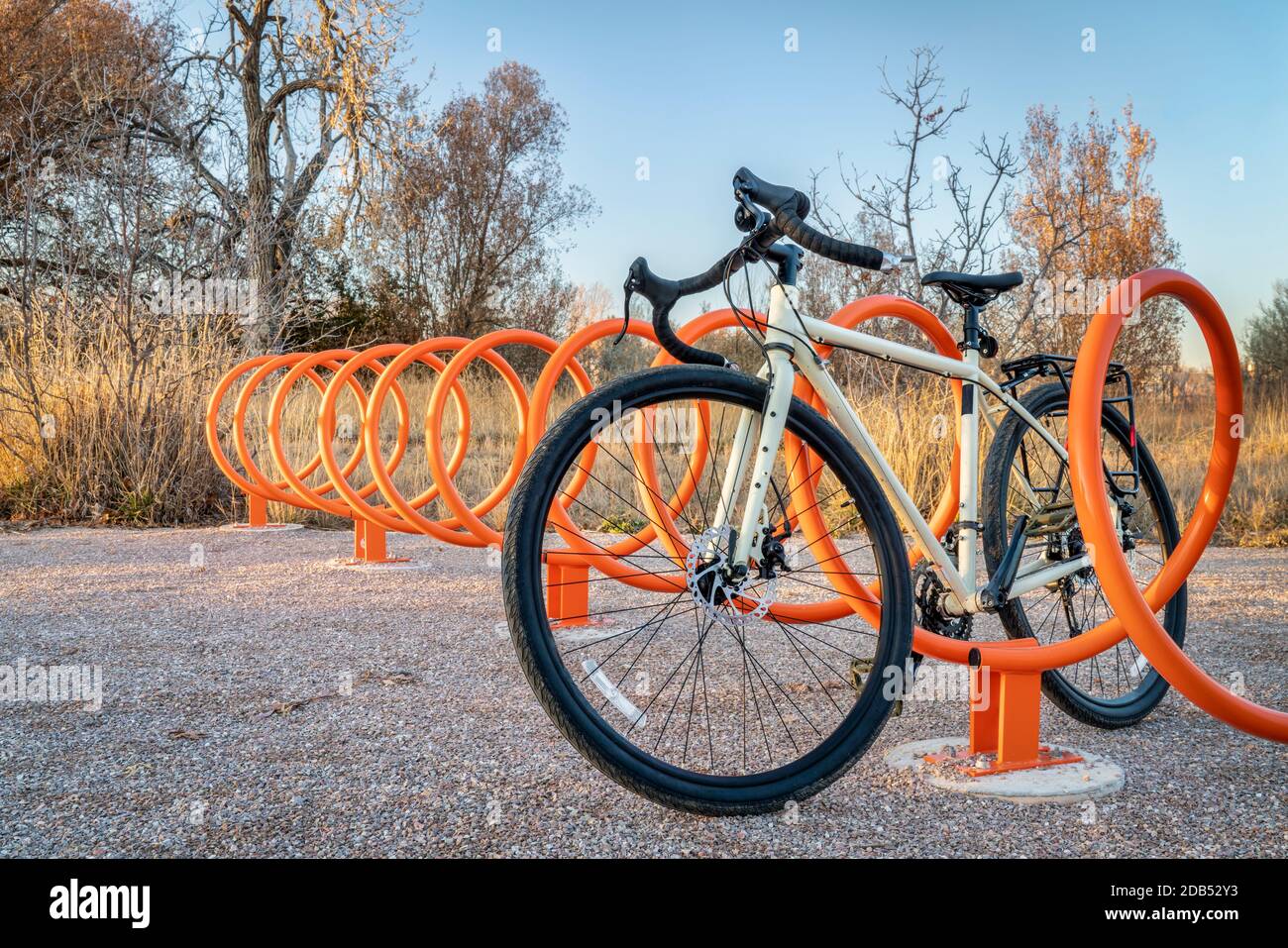touring bike parked in colorful helix bike racks along a trail in Fort ...