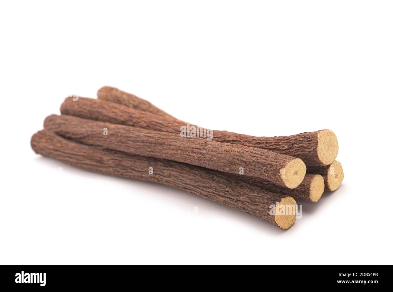 Licorice roots isolated on white background Stock Photo - Alamy