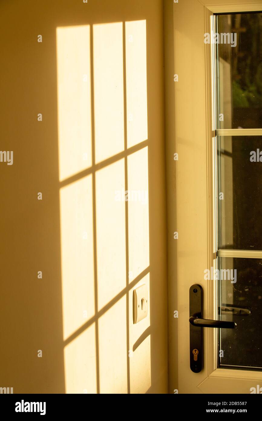 Sunlight shining through a door window Stock Photo - Alamy