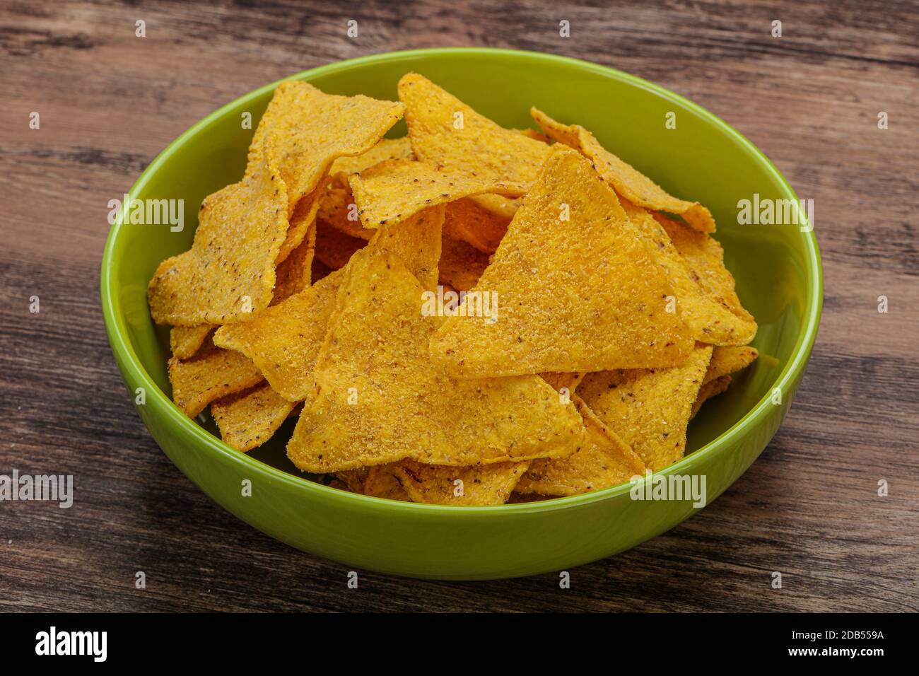 Mexican crunchy corn nachos triangle heap Stock Photo - Alamy