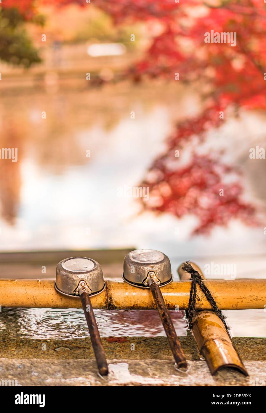 three water ladles on purification basin in the inokashira park of ...