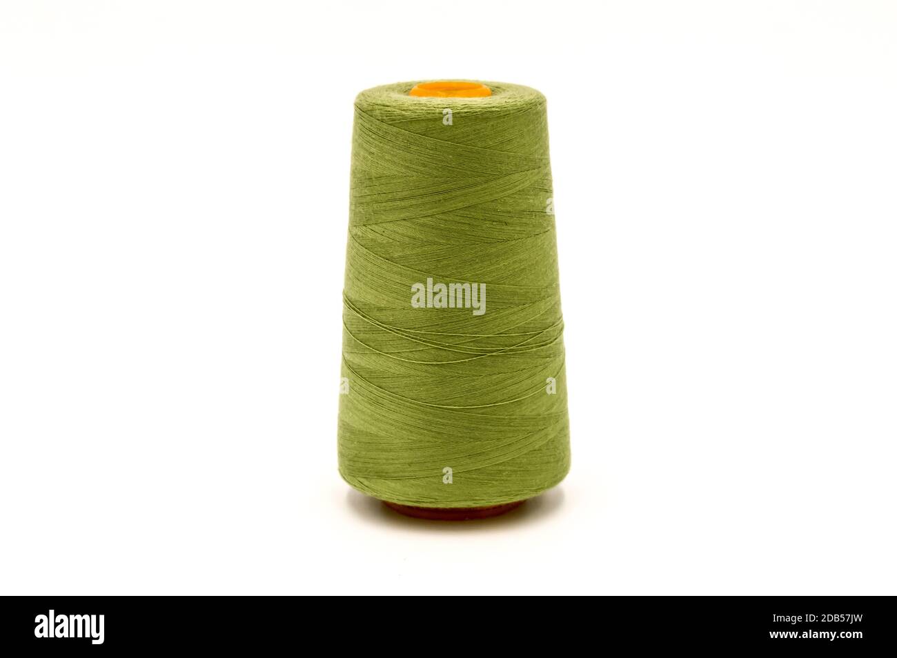 Close up of spool of colored thread on white background Stock Photo - Alamy