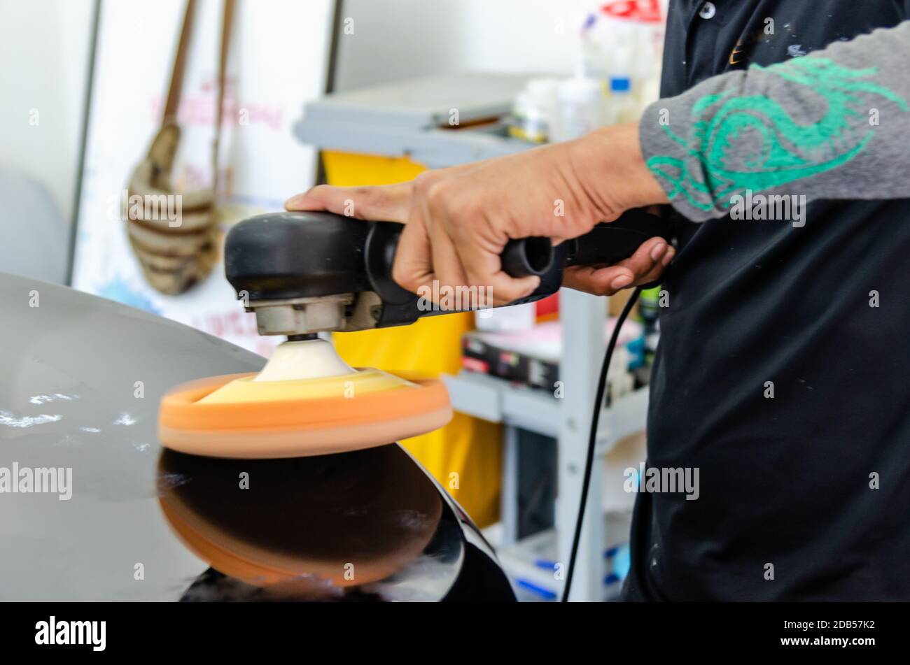 Man hands holding the work tool polish the car.Buffing and polishing ...