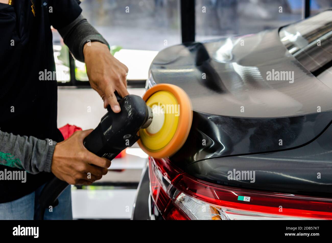 Man hands holding the work tool polish the car.Buffing and polishing ...