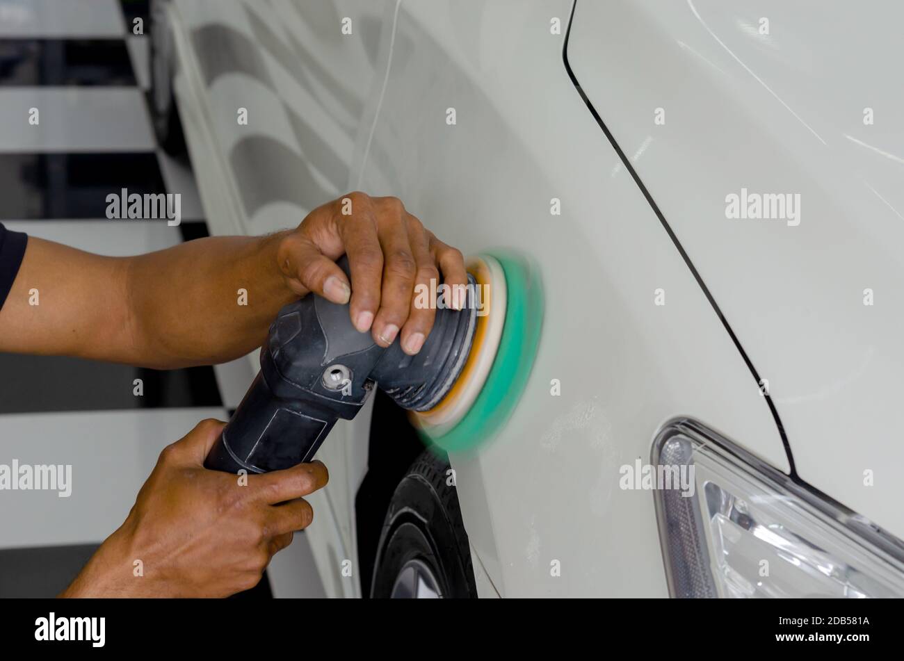 Man hands holding the work tool polish the car.Buffing and polishing ...