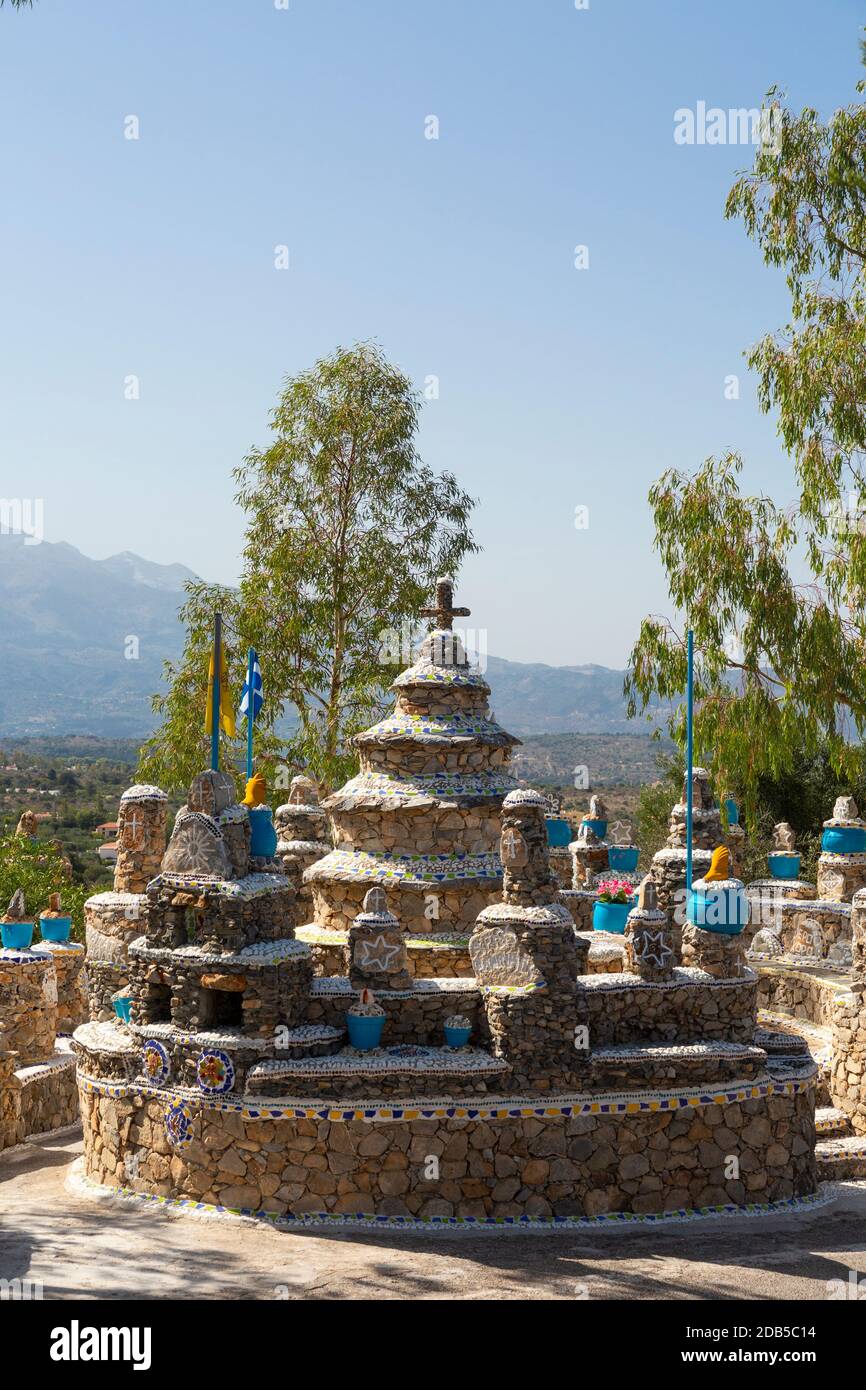 Religious stone welcome monument at the entrance to the village of ...