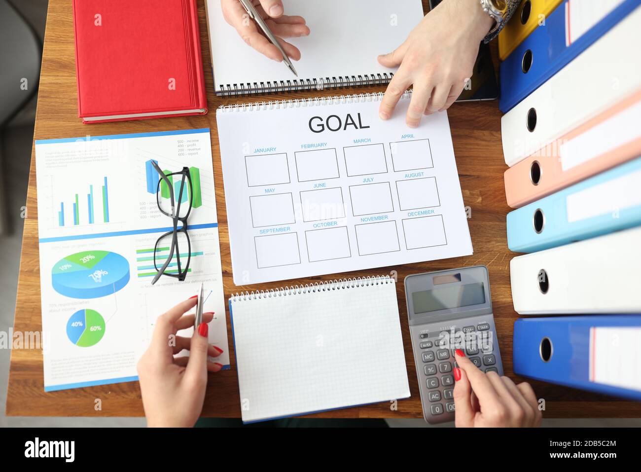 On the desktop is graph with goals for business Stock Photo - Alamy
