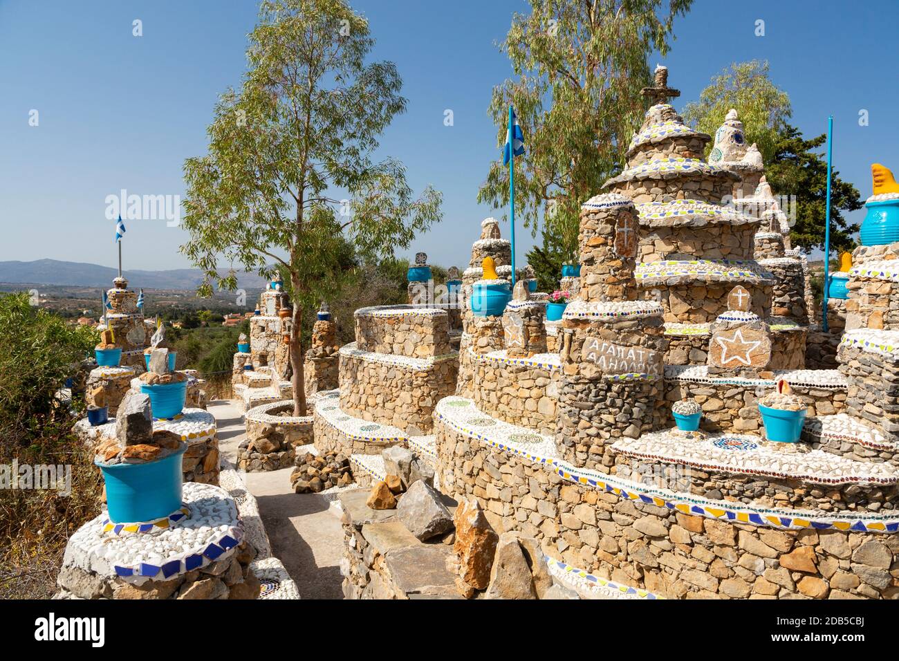 Religious stone welcome monument at the entrance to the village of ...