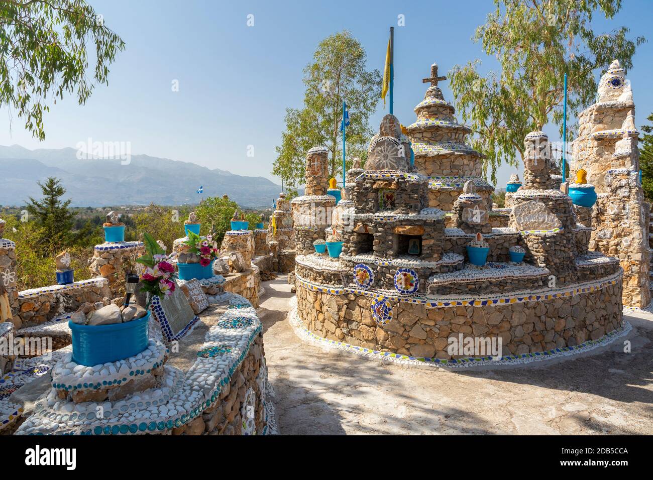 Religious stone welcome monument at the entrance to the village of ...