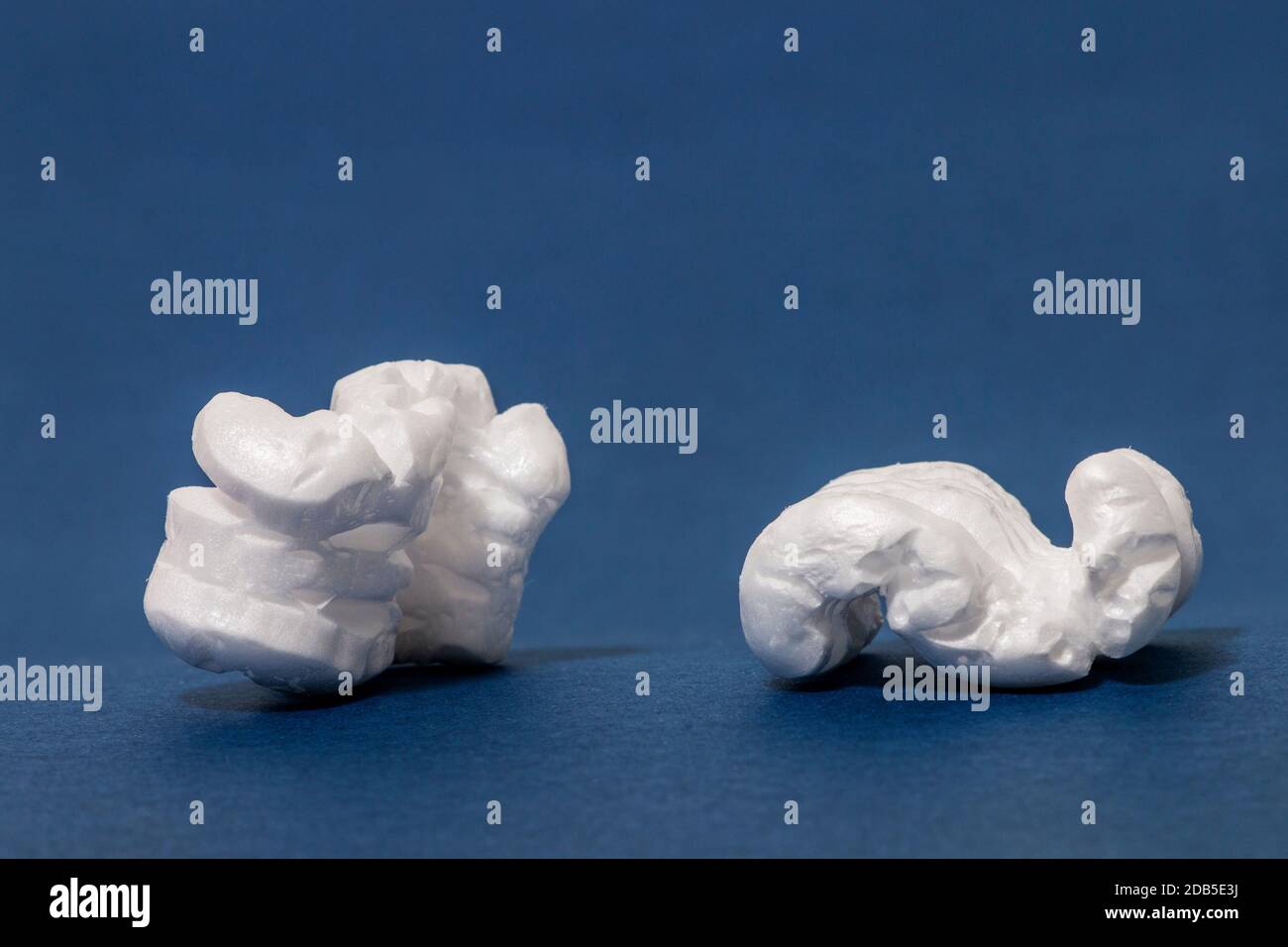 Polystyrene or white styrofoam packing pieces used for minimize bumps ...