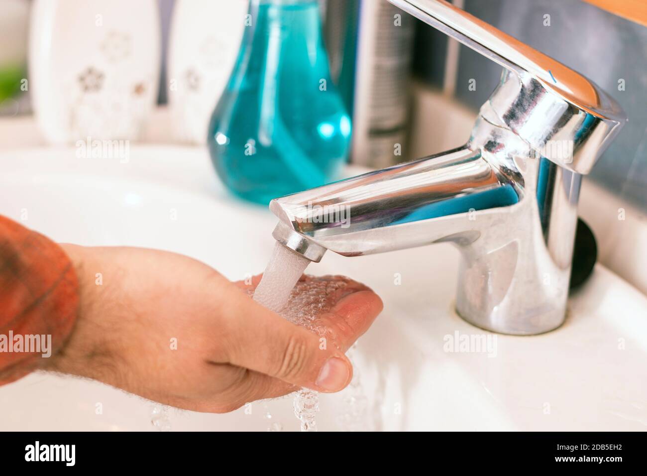 Close view of hands washing with water in the bathroom Stock Photo - Alamy