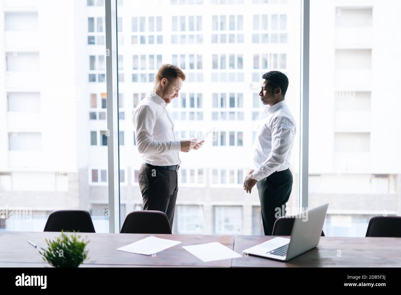 Side view of African american and caucasian European businessmen ...