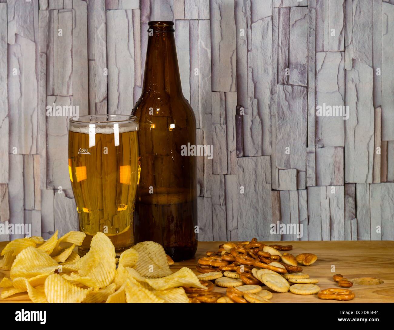 Cold beer snacks and potato chips Stock Photo - Alamy
