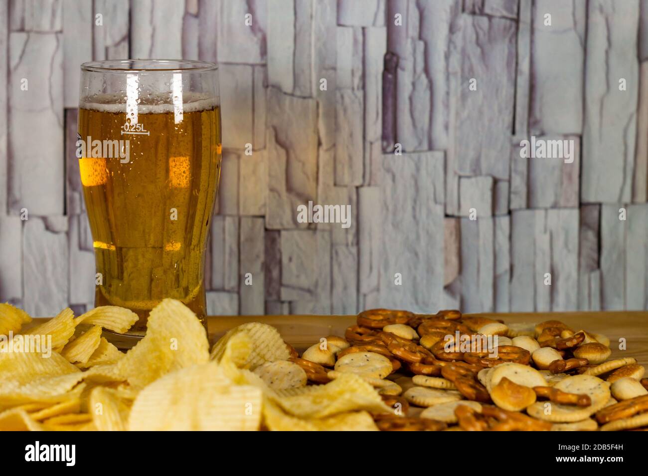 Cold beer snacks and potato chips Stock Photo - Alamy