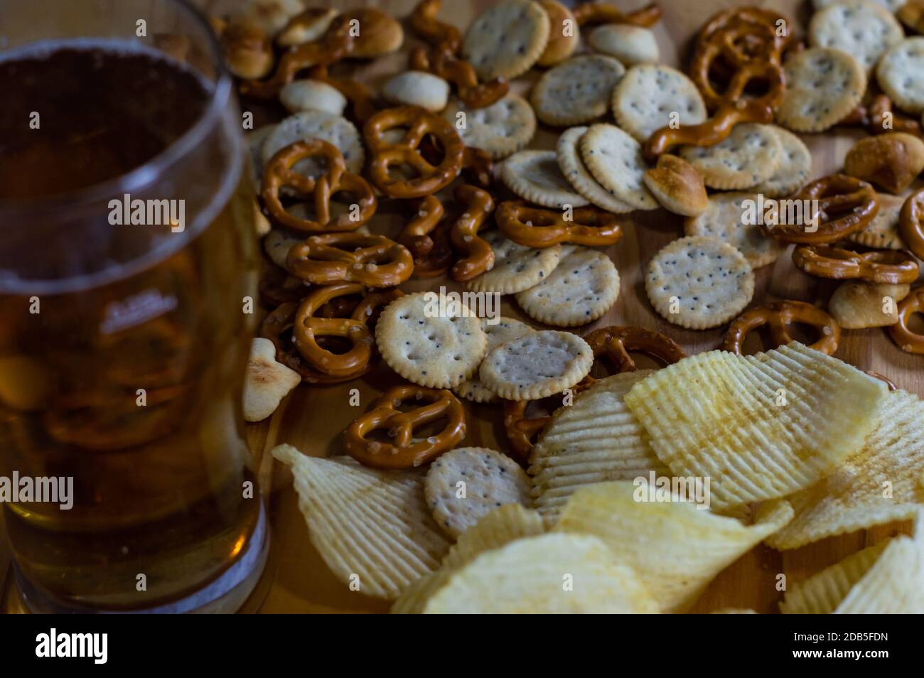 Cold beer snacks and potato chips Stock Photo - Alamy