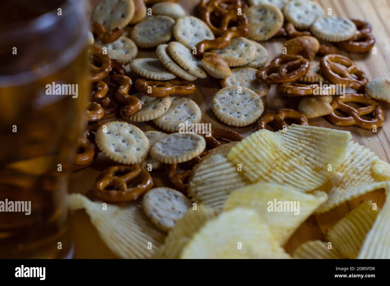 Cold beer snacks and potato chips Stock Photo - Alamy