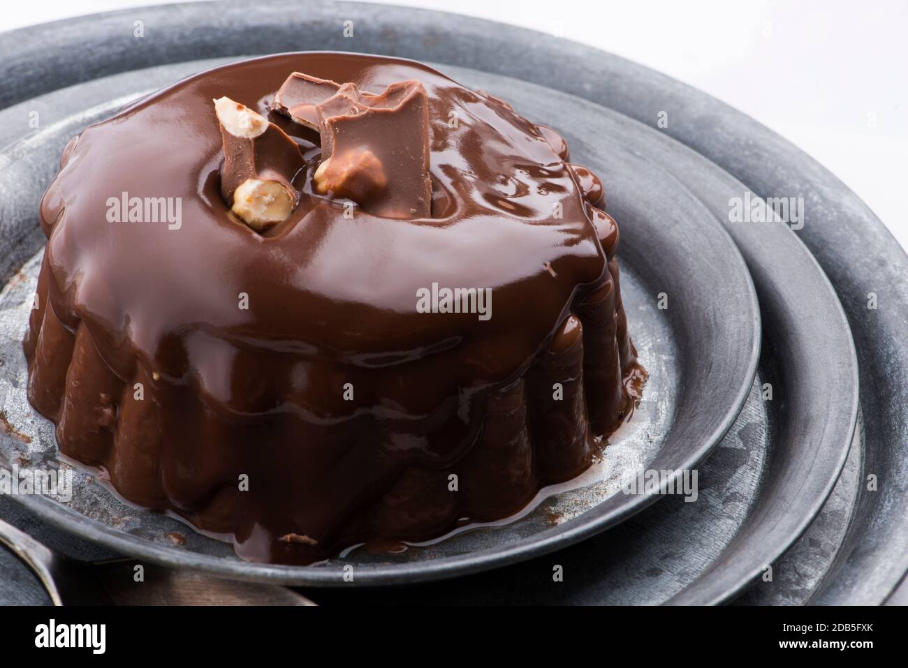Chocolate pudding with chocolate dressing on a plate Stock Photo - Alamy
