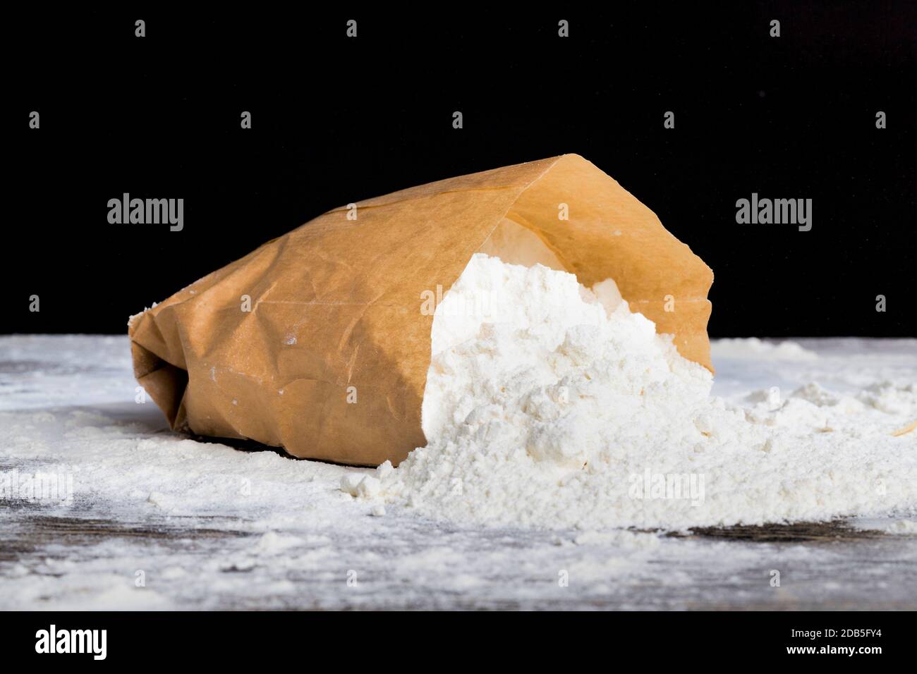 white wheat flour on the Board, close-up in the kitchen while cooking ...