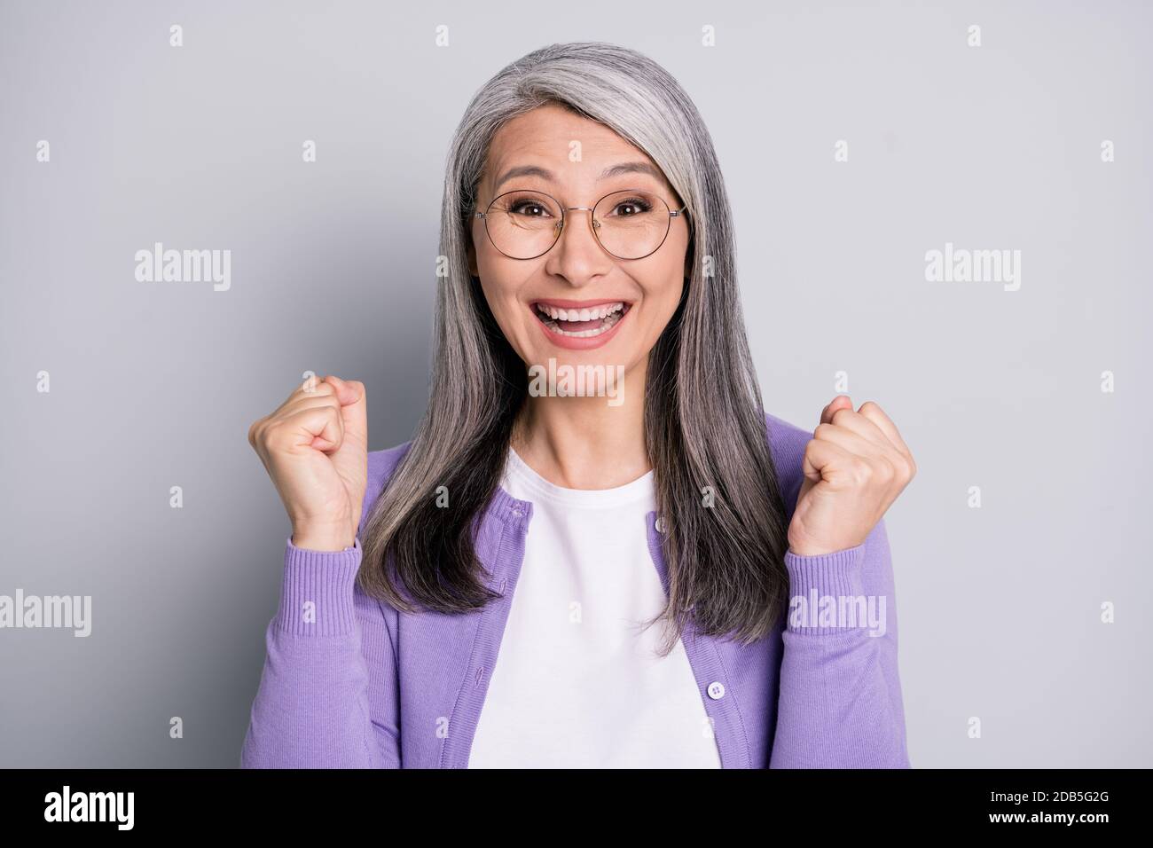 Photo of funny lovely retired lady raise up fists excited surprised ...