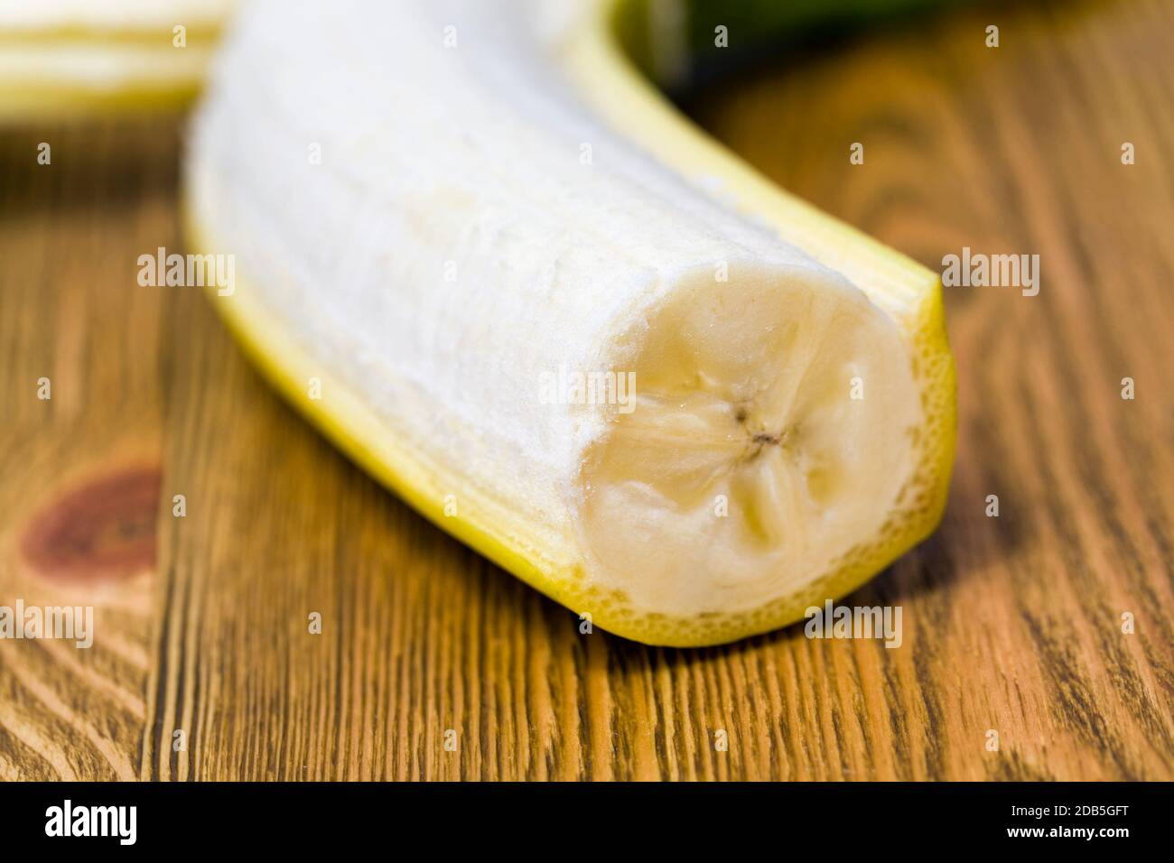 peeled ripe yellow banana, the details of the fruit, ready for eating ...