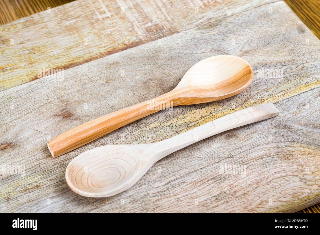 simple wooden empty spoon on a wooden table, close-up Stock Photo - Alamy