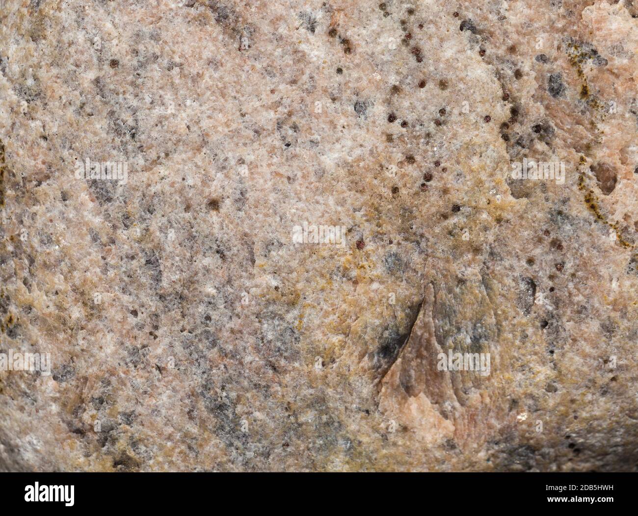 the structure of a large stone having several different colors, close ...