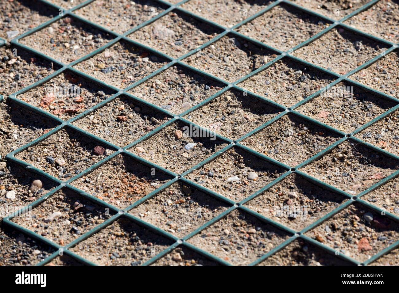 plastic geonet reinforcement on the soil to hold the ground at the ...