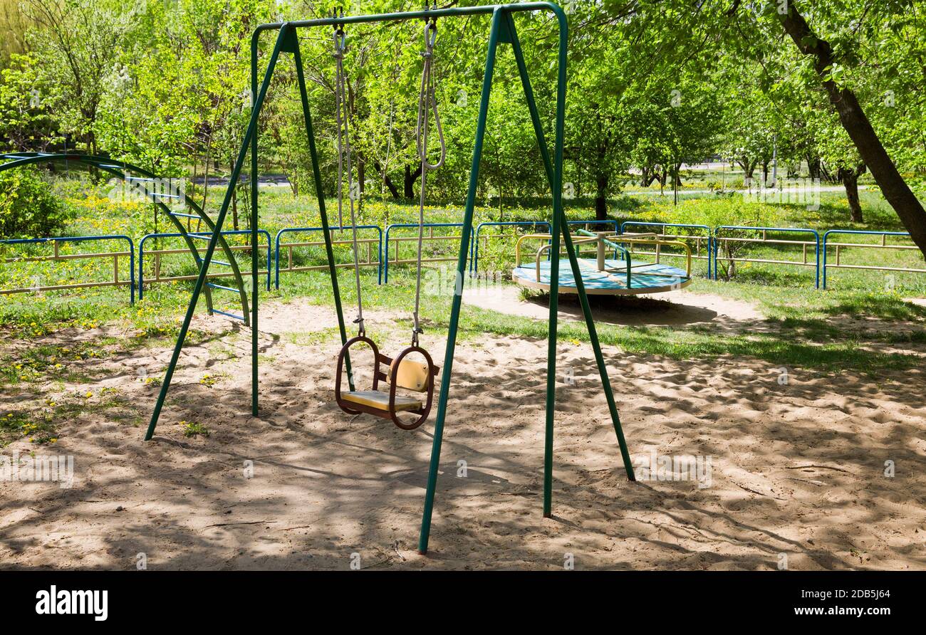 old ordinary swing for children to relax for a walk and Playground for ...