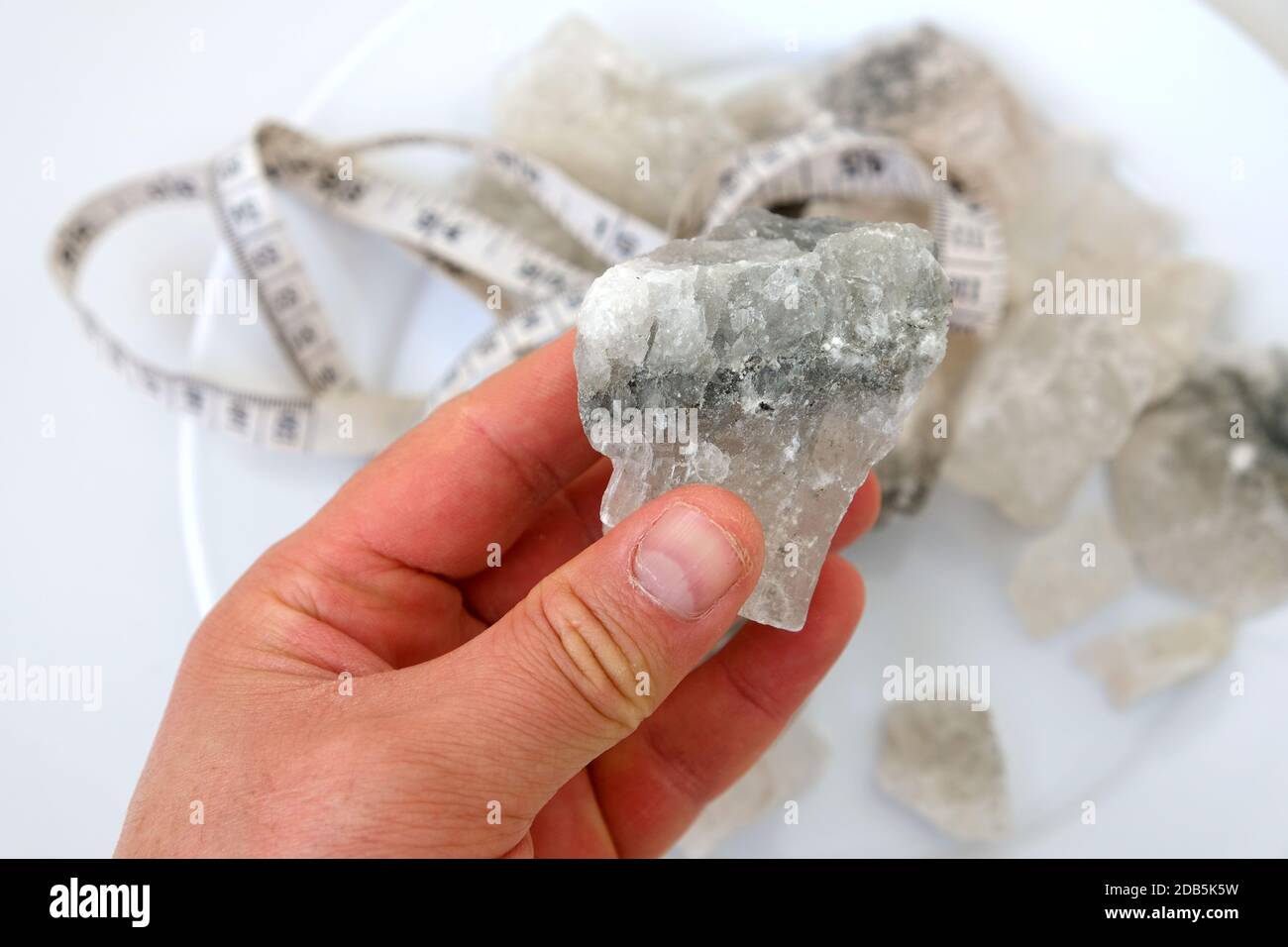 salt and weight gain, the harm of salt for man Stock Photo - Alamy