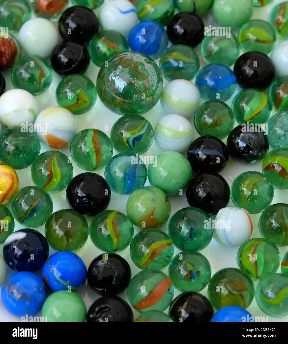 Colored glass balls on 360 degree rotating stand Stock Photo - Alamy