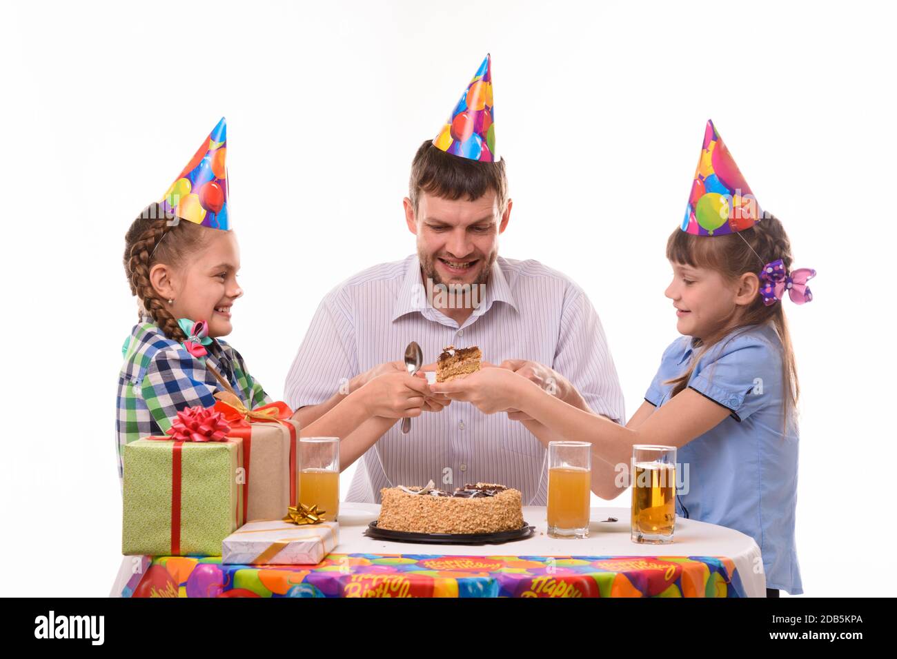 Children fight for the first piece of birthday cake Stock Photo - Alamy