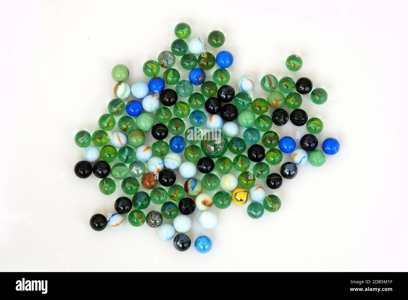 fun game for kids with colored glass marbles, glass balls Stock Photo ...
