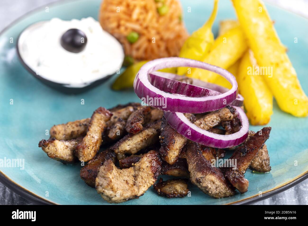 greek gyros on a plate with fries Stock Photo - Alamy