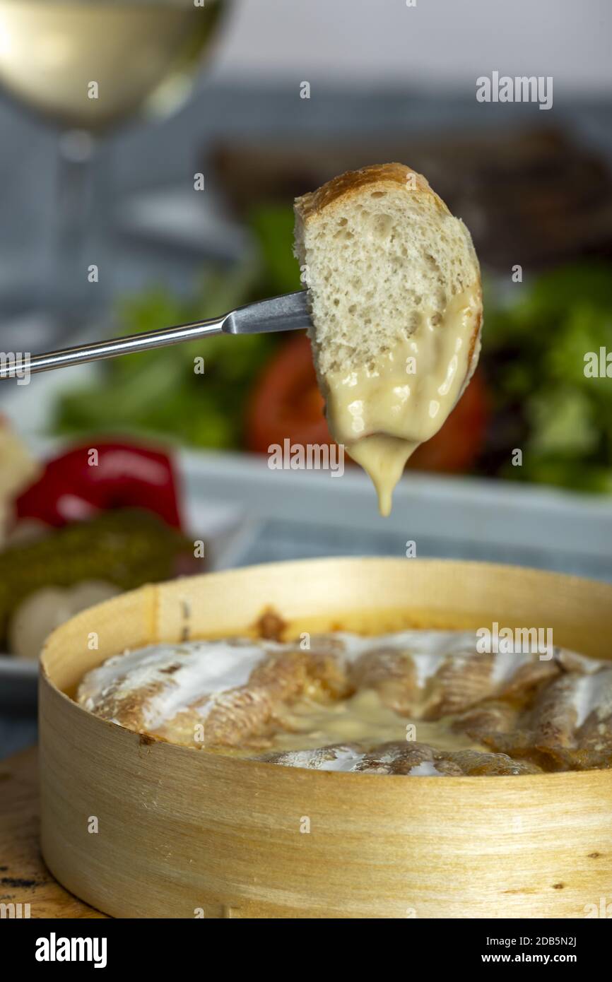 swiss cheese fondue with bread Stock Photo - Alamy