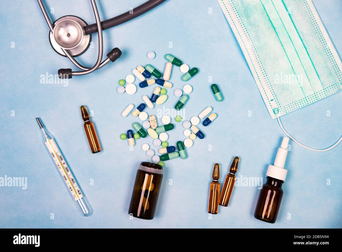 Flat-lay of medical equipment on blue background. Disease prevention ...