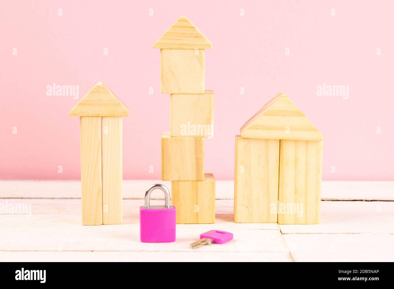 The wooden cubes are lined in the form of houses, next pads and keys. The concept of orend ...