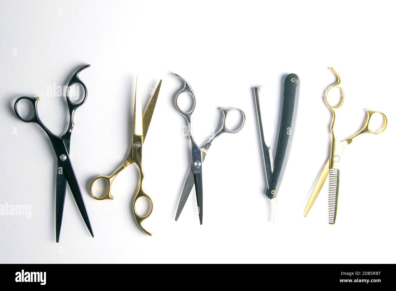 Open scissors for haircut isolated on a white background. Top views ...